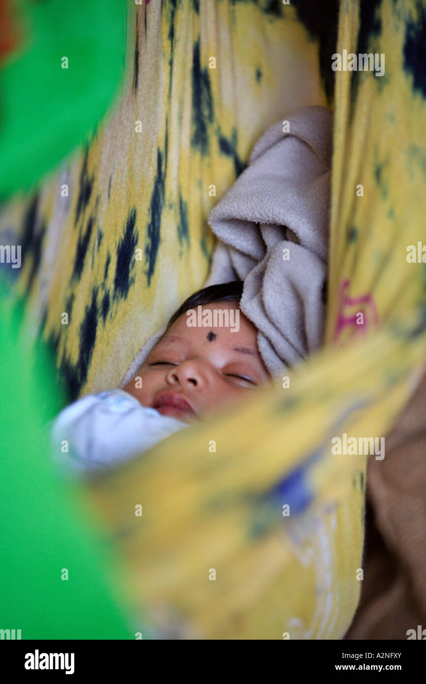 INDIA NORTH GOA ANJUNA WEEKLY MARKET A BABY ASLEEP IN HAMMOCK Stock ...