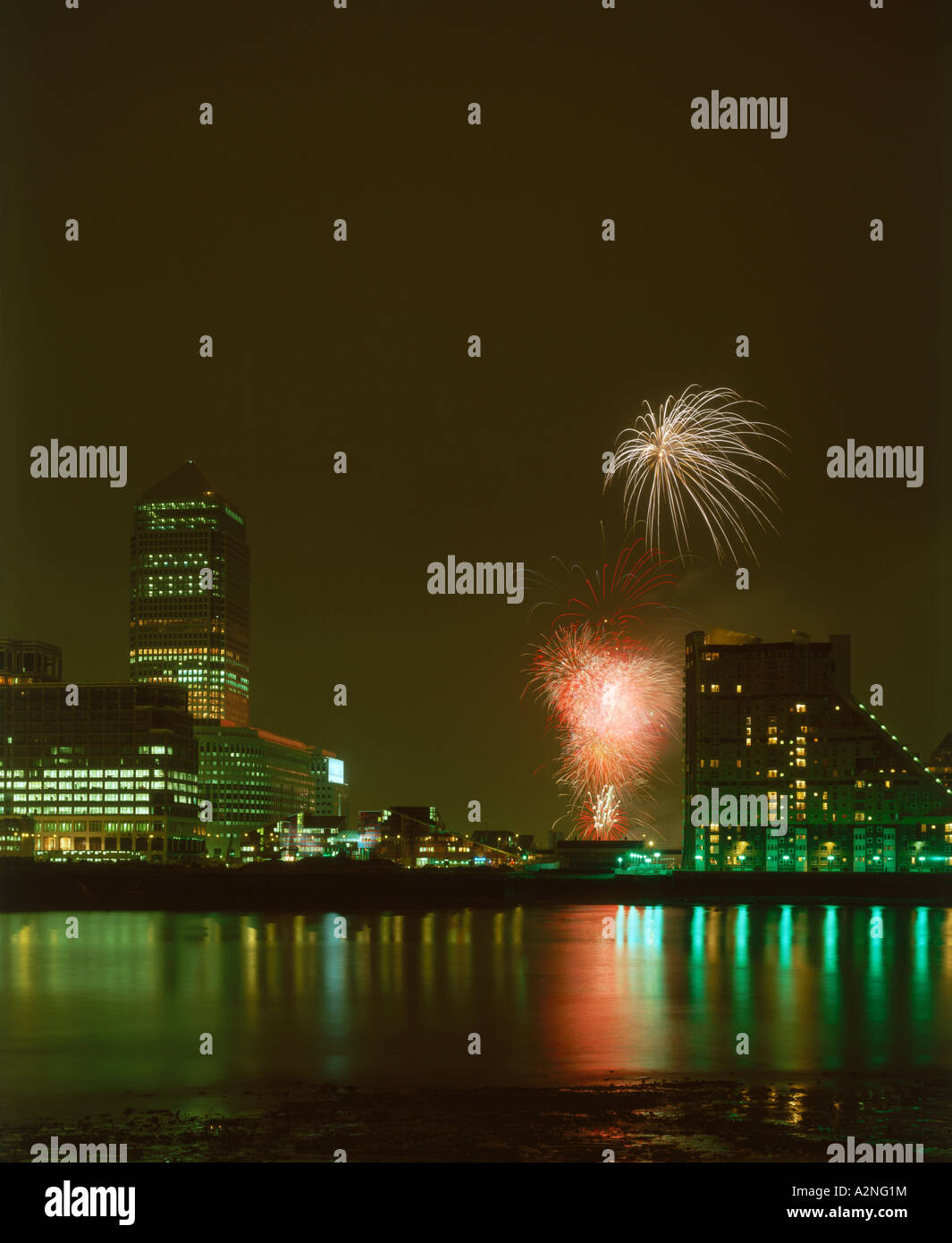Fireworks over city, Canary Wharf, Thames River, London, England Stock ...