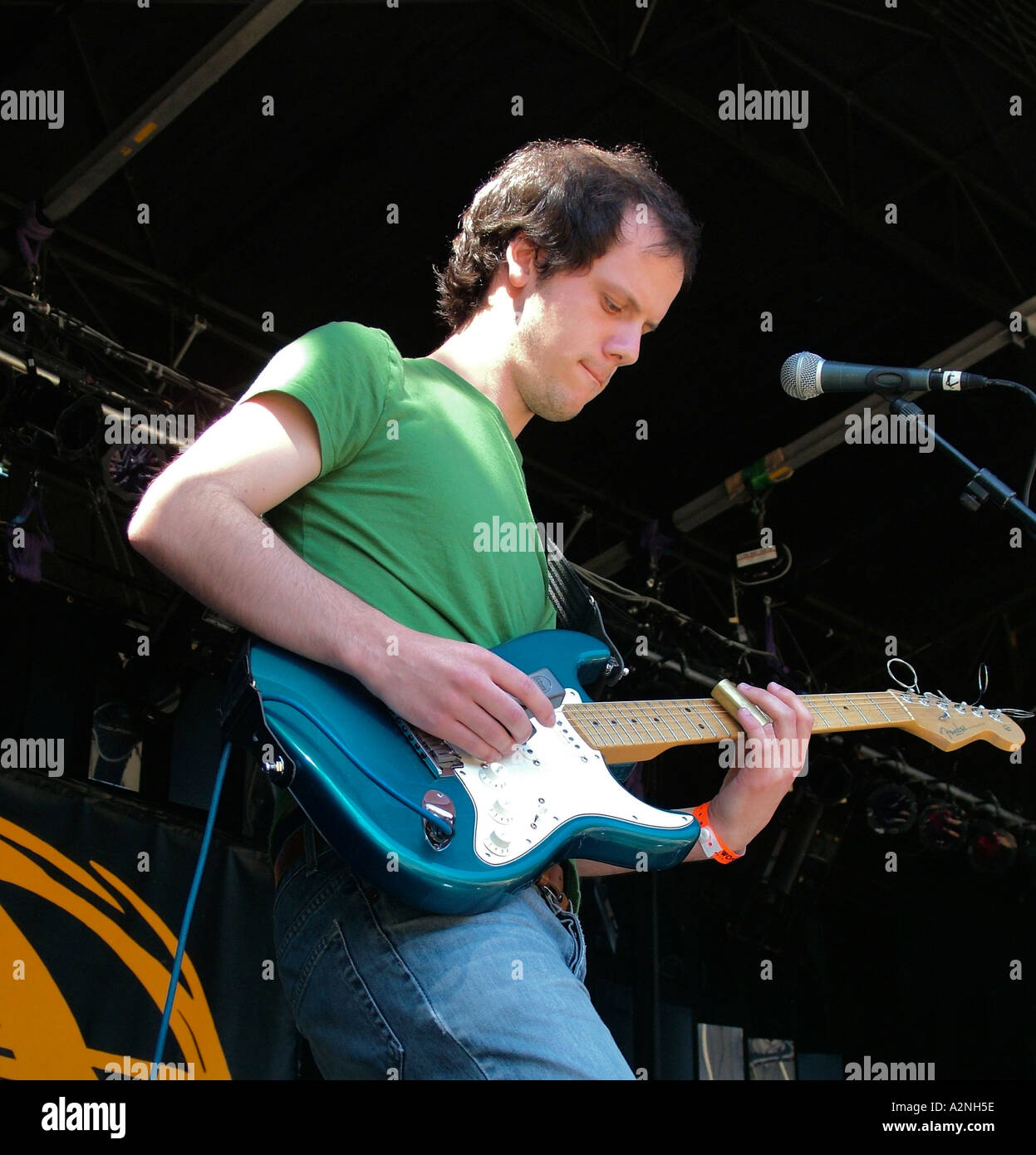 Bass player in a band performing at WOMAD Stock Photo - Alamy