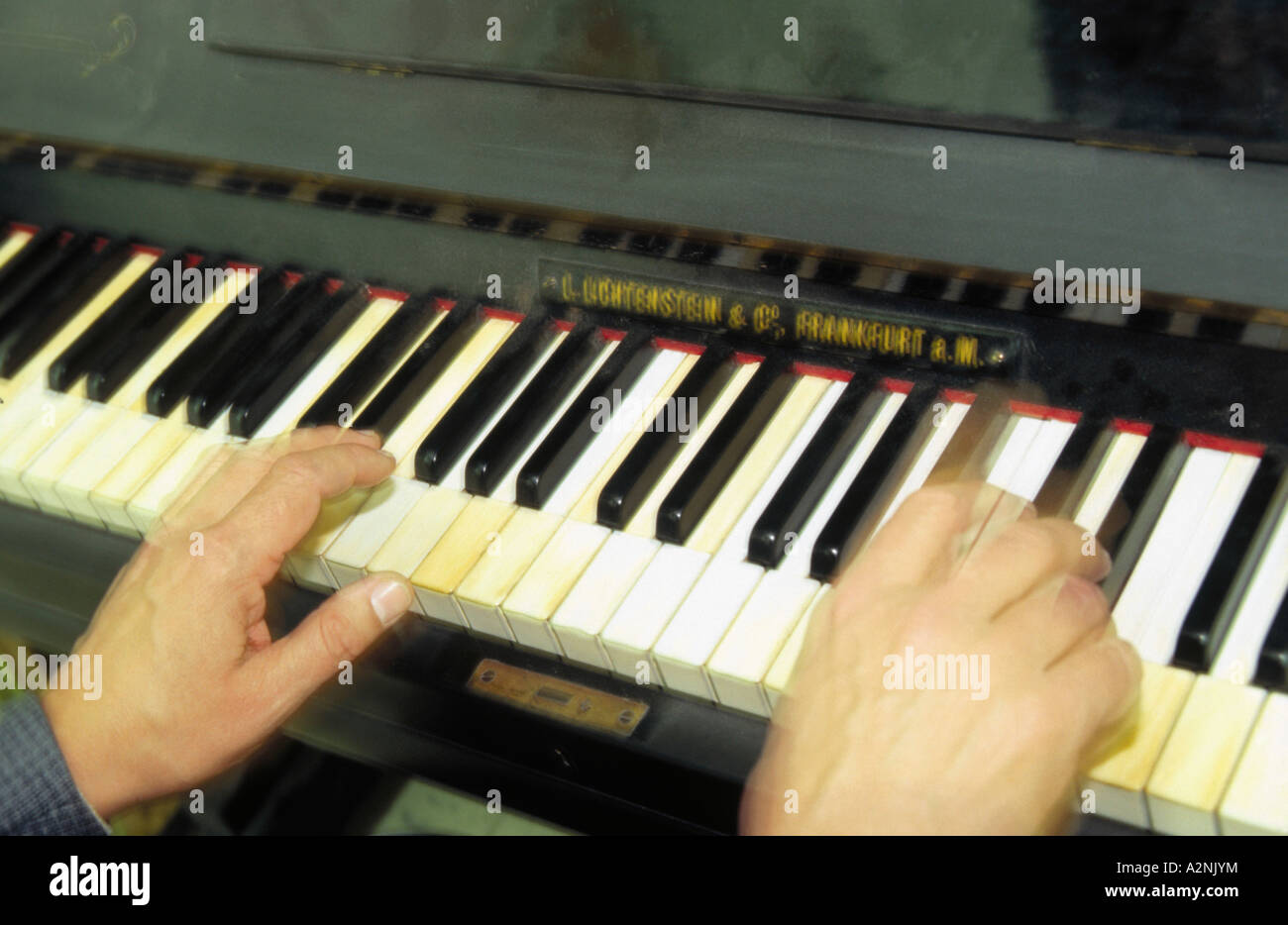 Human hands playing piano Stock Photo - Alamy