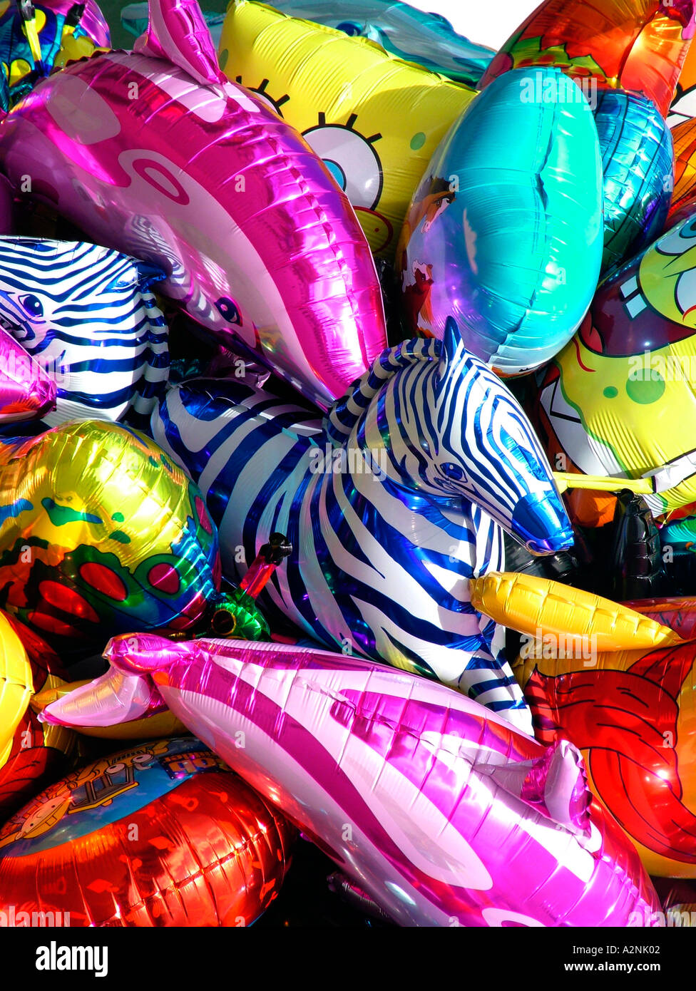 Close up of Brightly coloured blue red yellow and orange balloons at ...