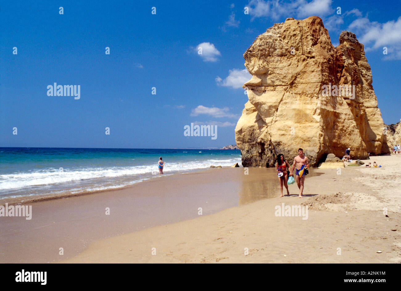 two people walking on the beach, Algarve, Portugal Stock Photo - Alamy