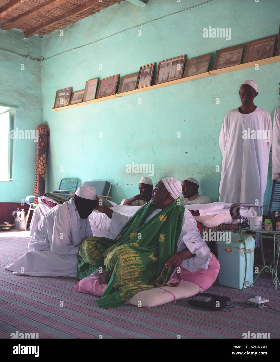 Sufi sheick surrounded by followers, Sudan Stock Photo - Alamy