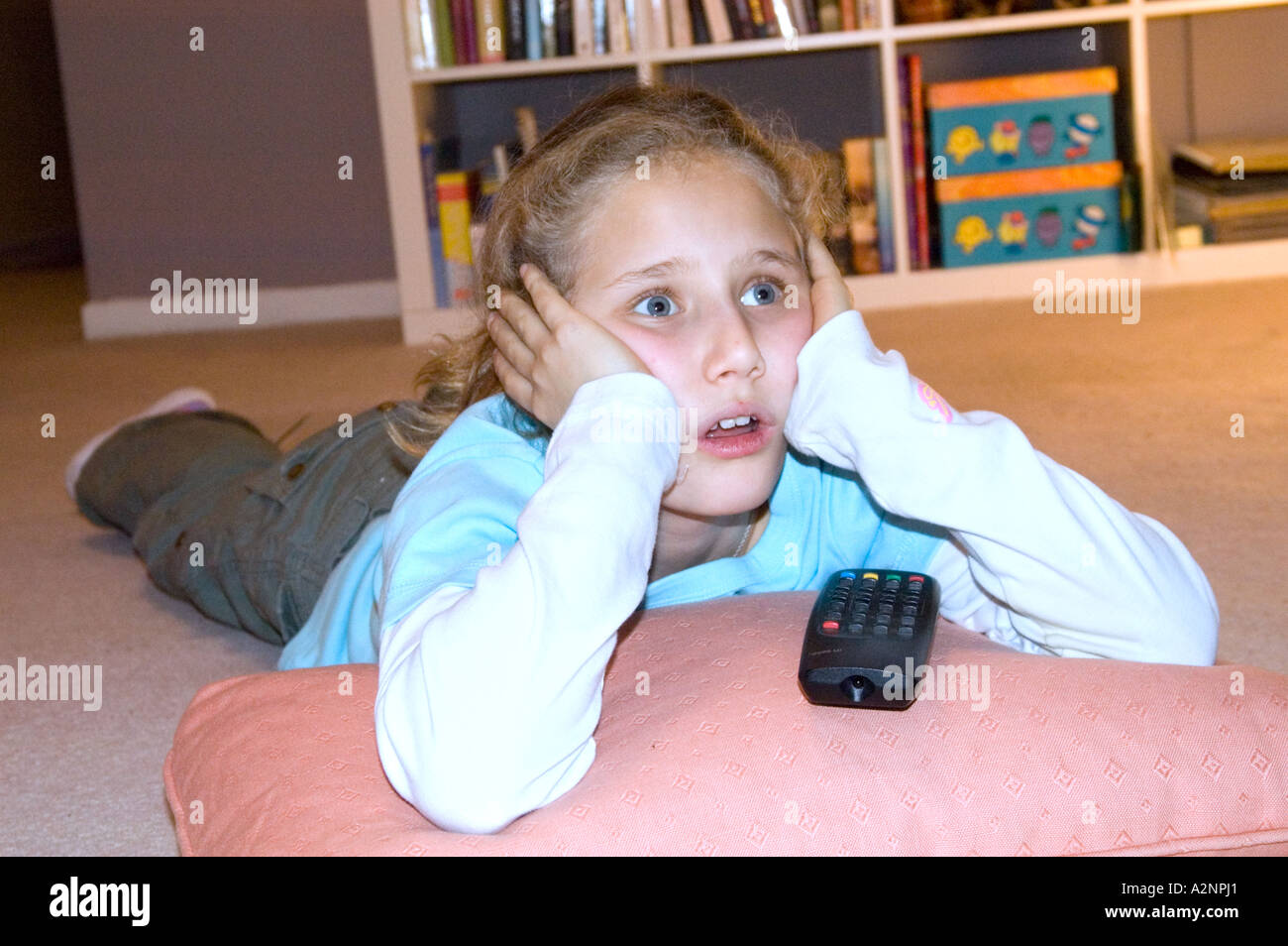 Young girl watching television at home England UK Stock Photo - Alamy