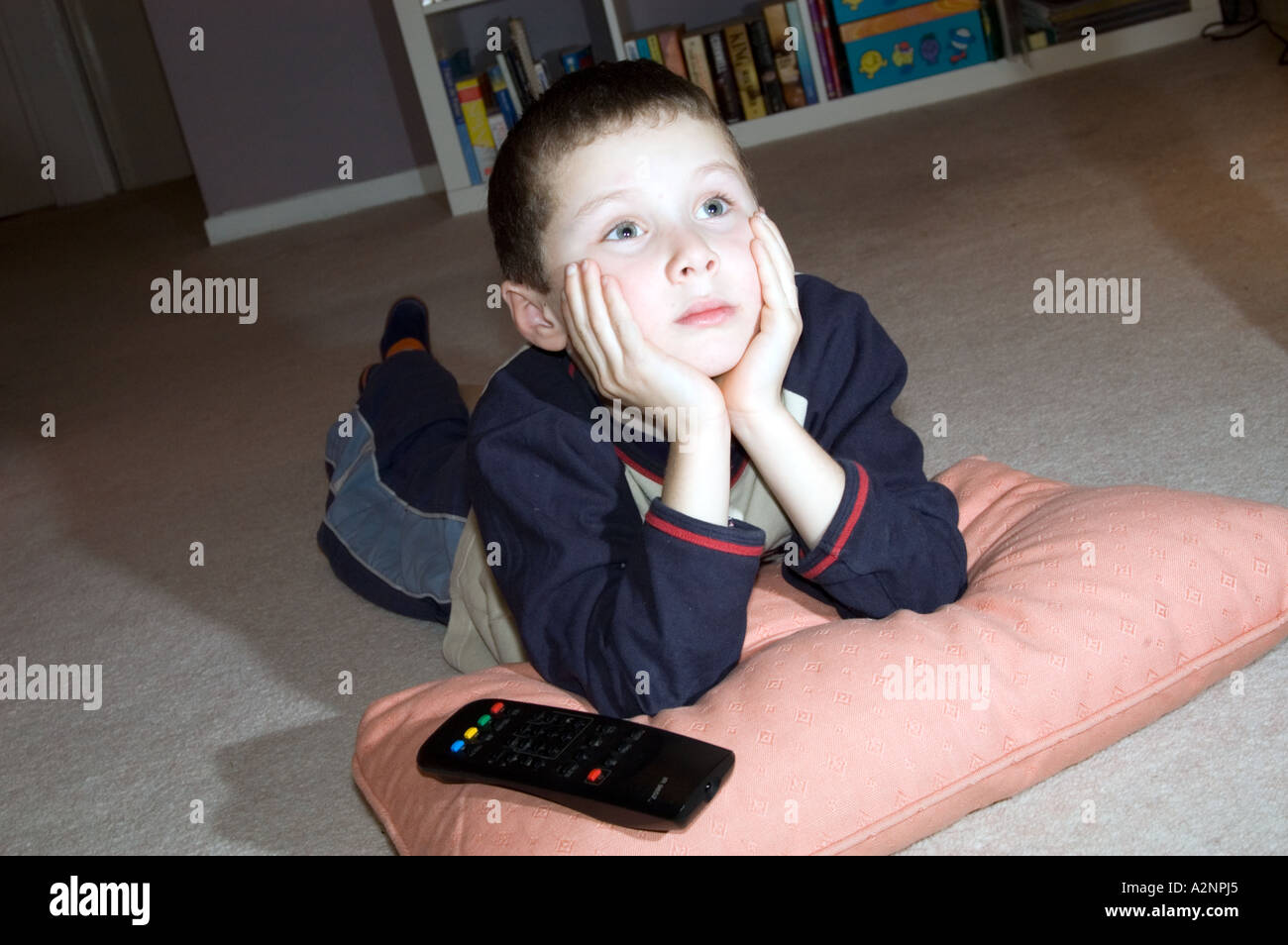 Young boy watching television at home, England UK Stock Photo - Alamy