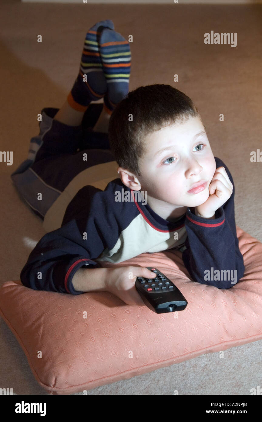 Young boy watching television at home England UK Stock Photo - Alamy