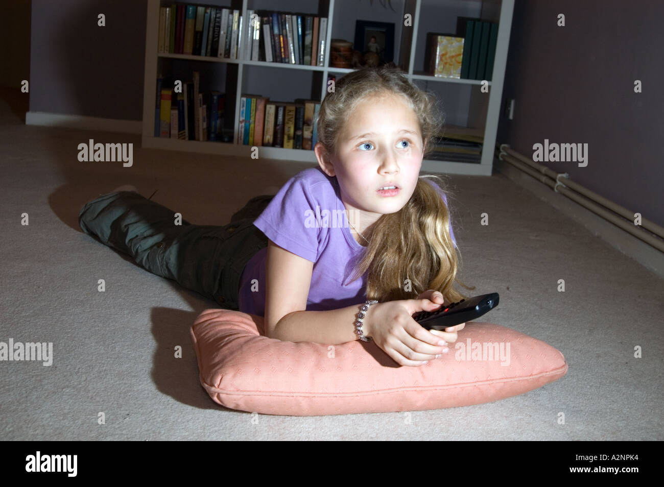 Young girl watching television at home England UK Stock Photo - Alamy