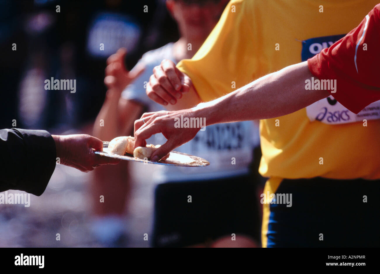 Close-up of a jogger picking a snack while running Stock Photo - Alamy