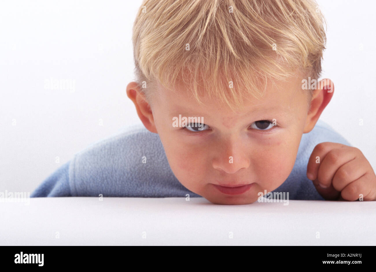 Portrait of boy looking serious Stock Photo - Alamy
