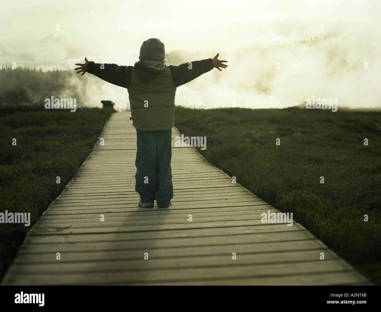 Boy arms out stretched hi-res stock photography and images - Alamy