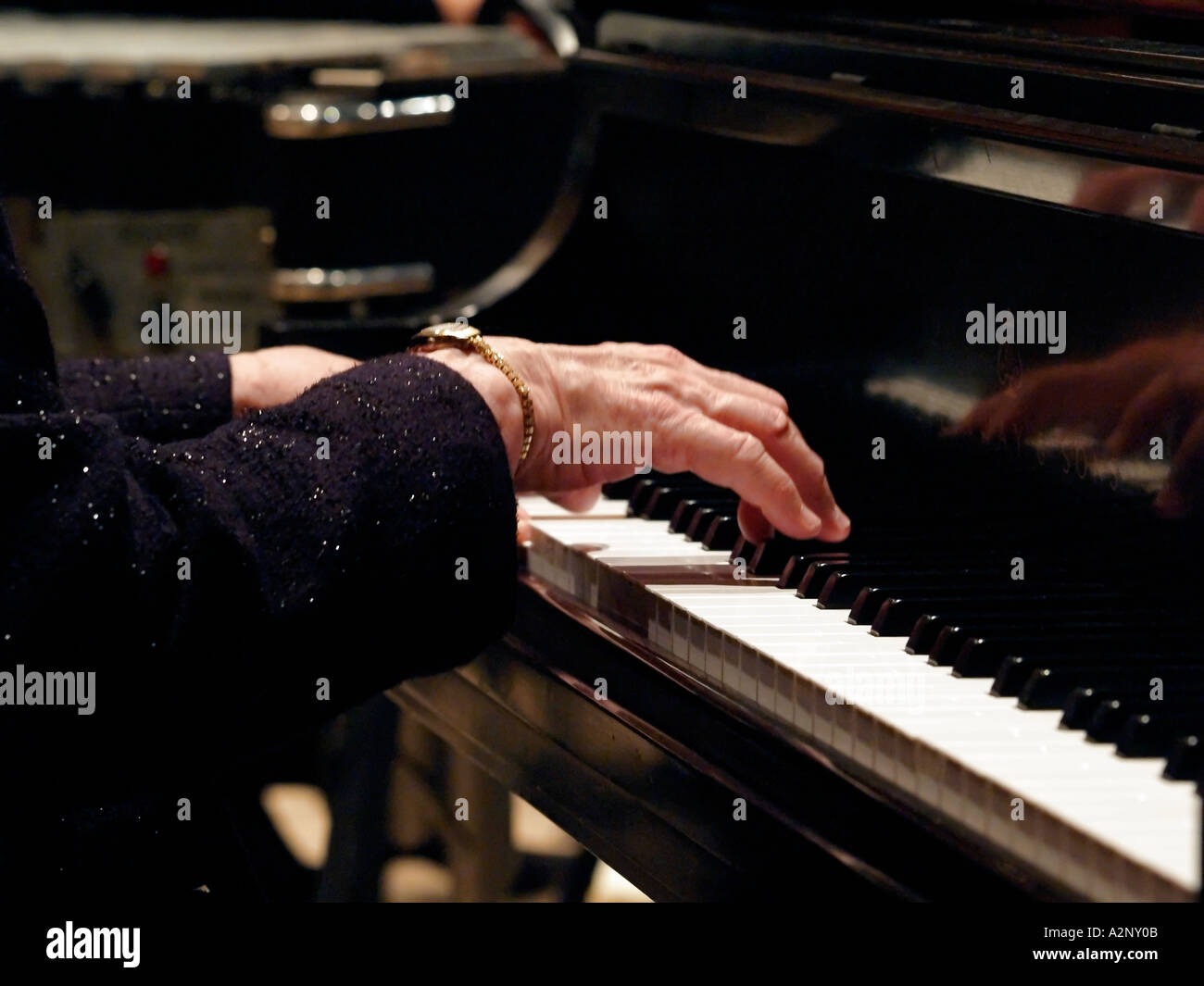 Mature hands playing piano in performance Stock Photo - Alamy