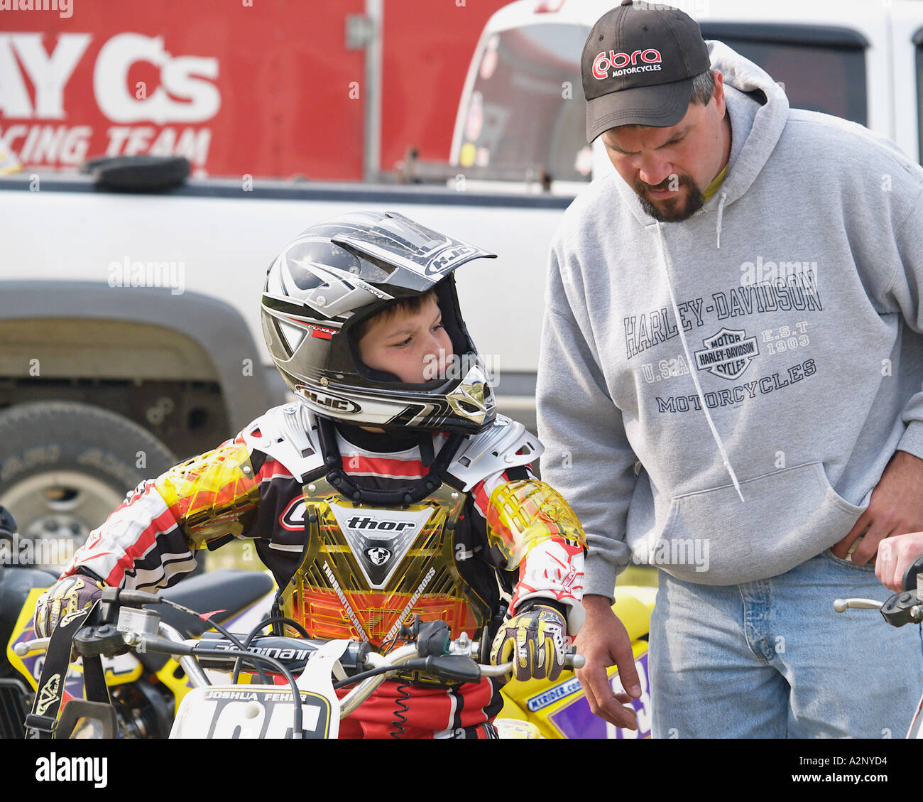 Josh Feher gets a few final pointers from his father Jimmy before ...