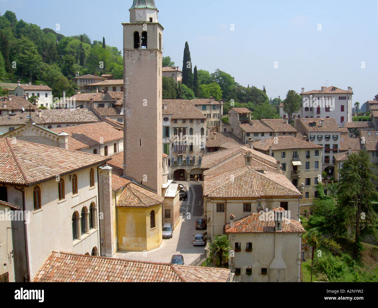 The cathedral campanile rises above the roof tiles in the centre of the ...