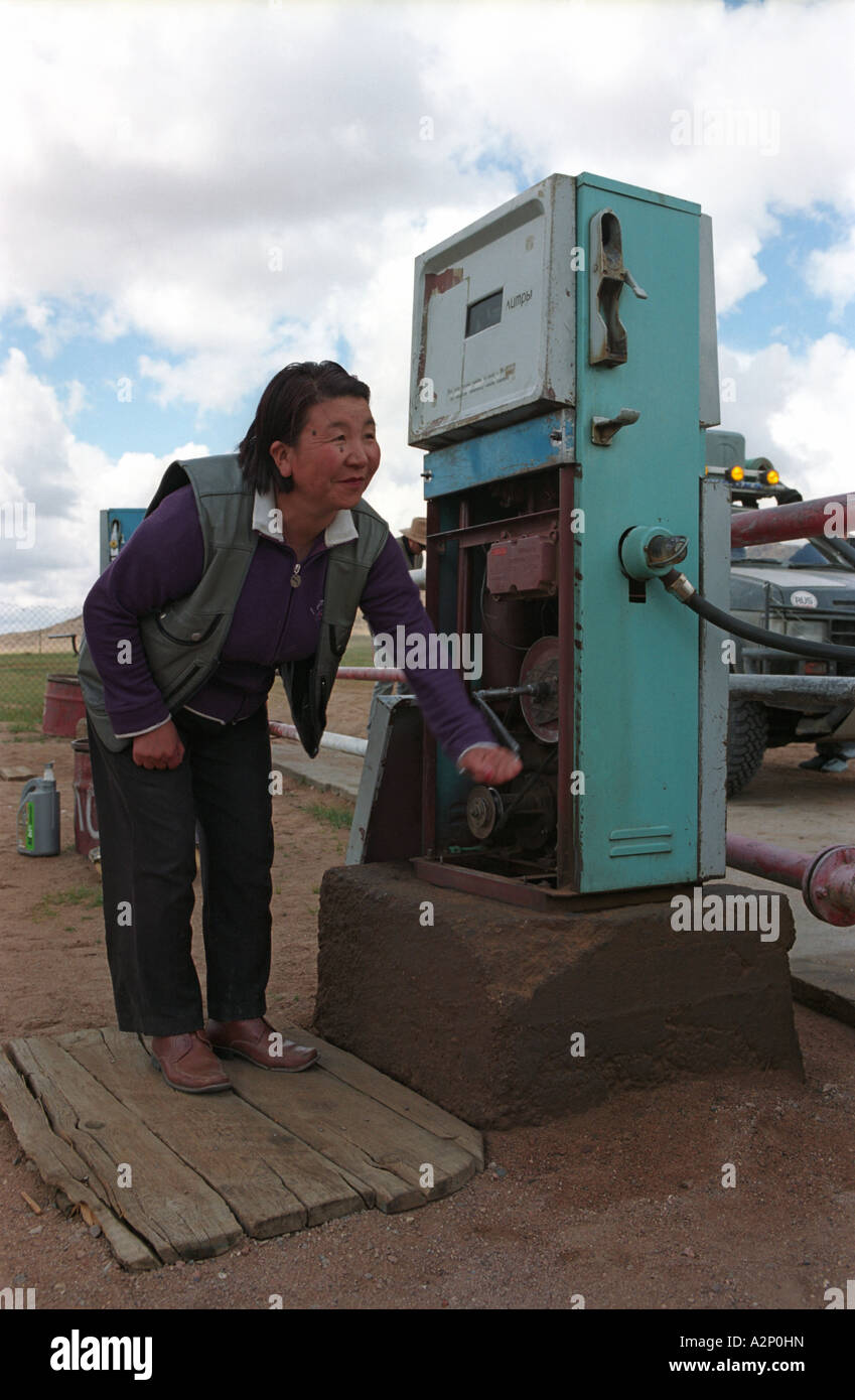 Gasoline station worker refuel an off-road vehicle. Numrug somon ...