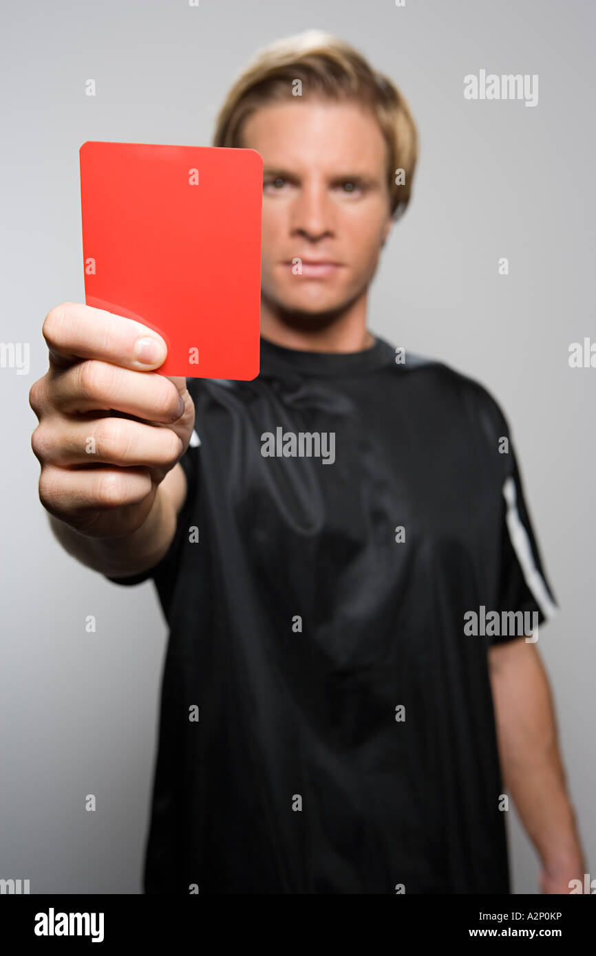Referee holding red card Stock Photo - Alamy