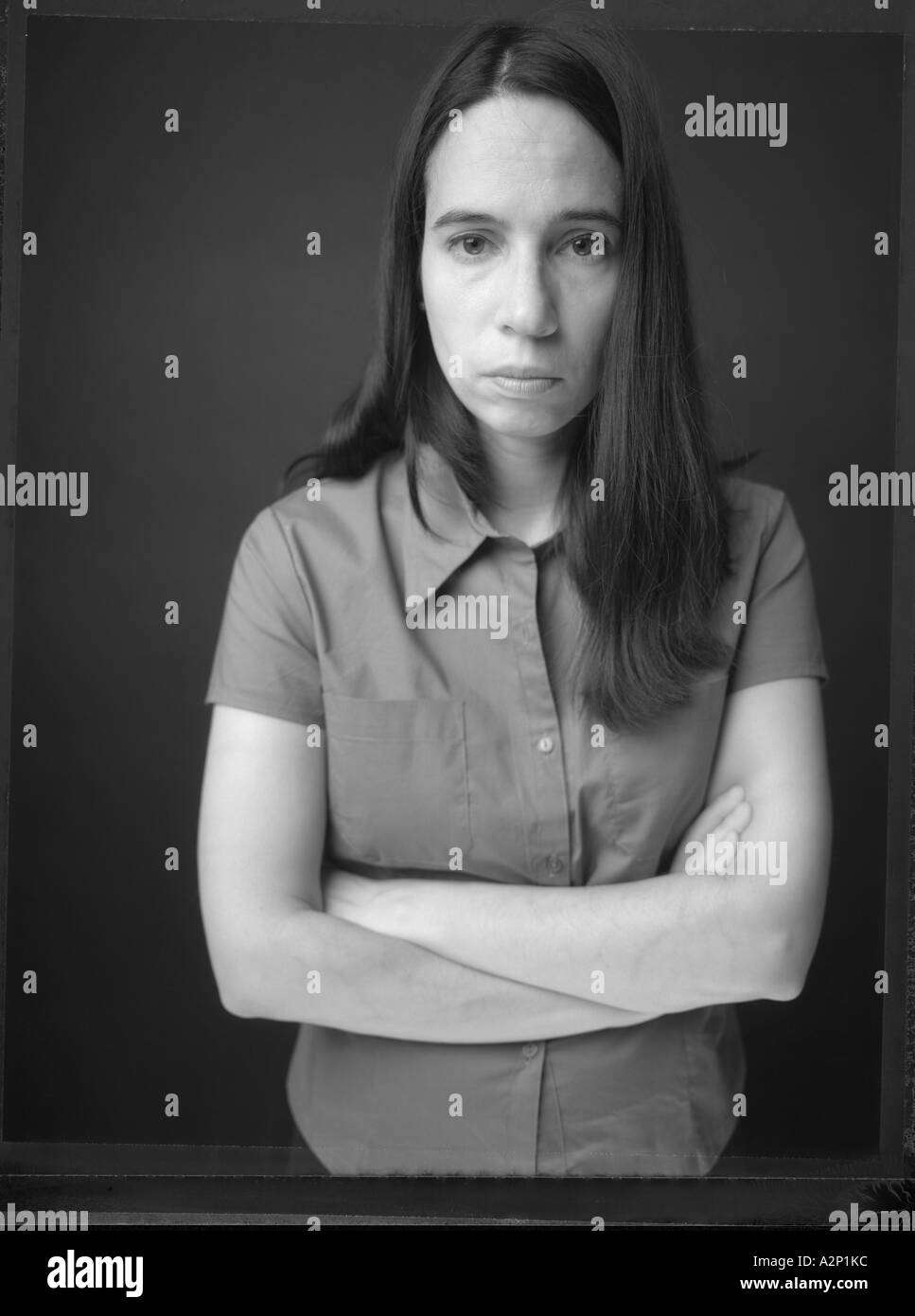 Sad woman looking into camera Stock Photo - Alamy