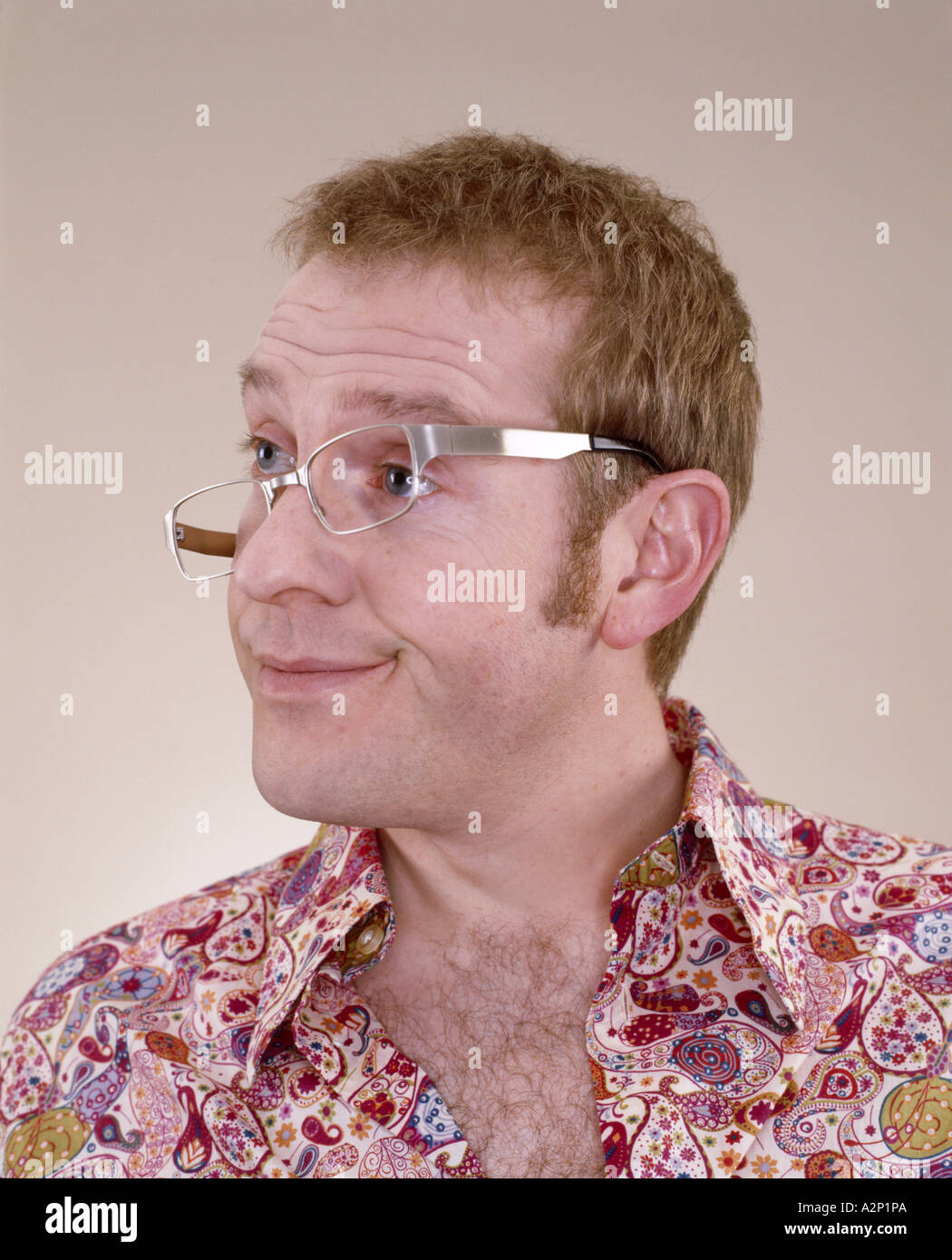 Man with glasses pulling face looking left Stock Photo - Alamy