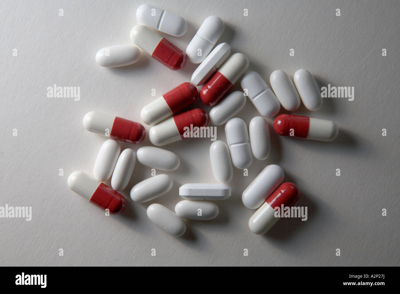 lots of red and white pills on a white background birds eye view Stock ...