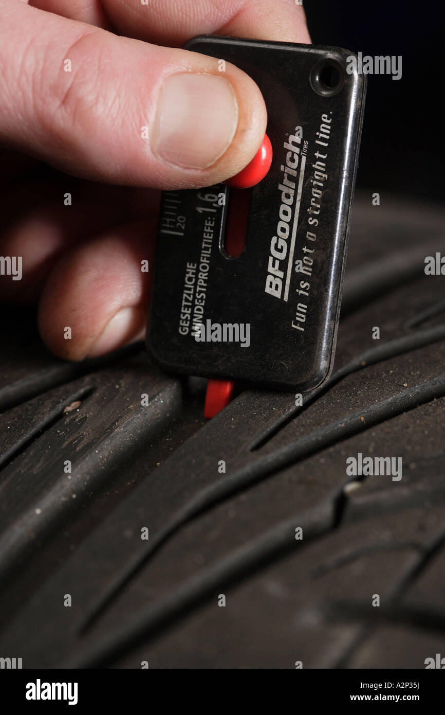Control of the tyre tread with a measuring tool Stock Photo - Alamy