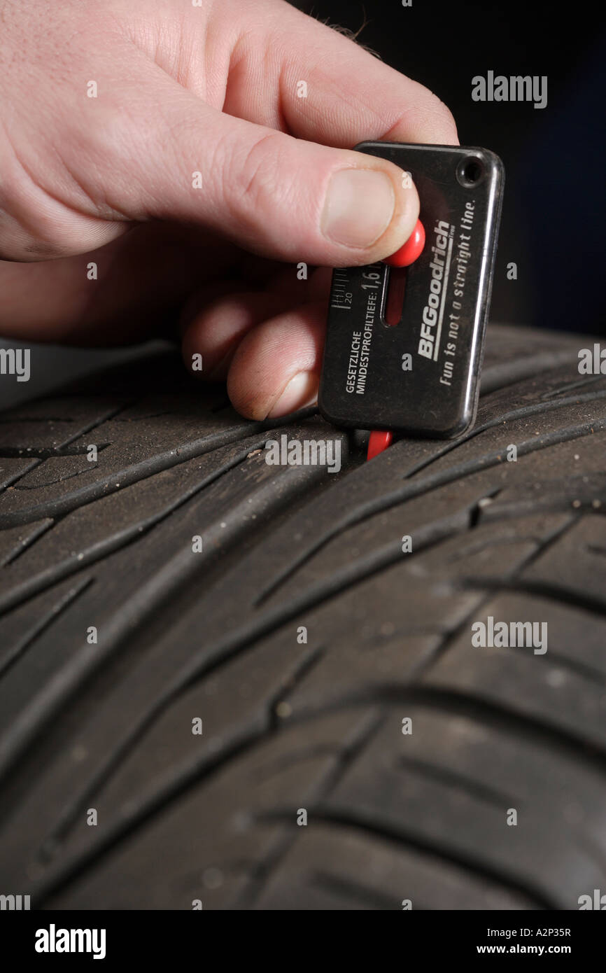 Control of the tyre tread with a measuring tool Stock Photo - Alamy