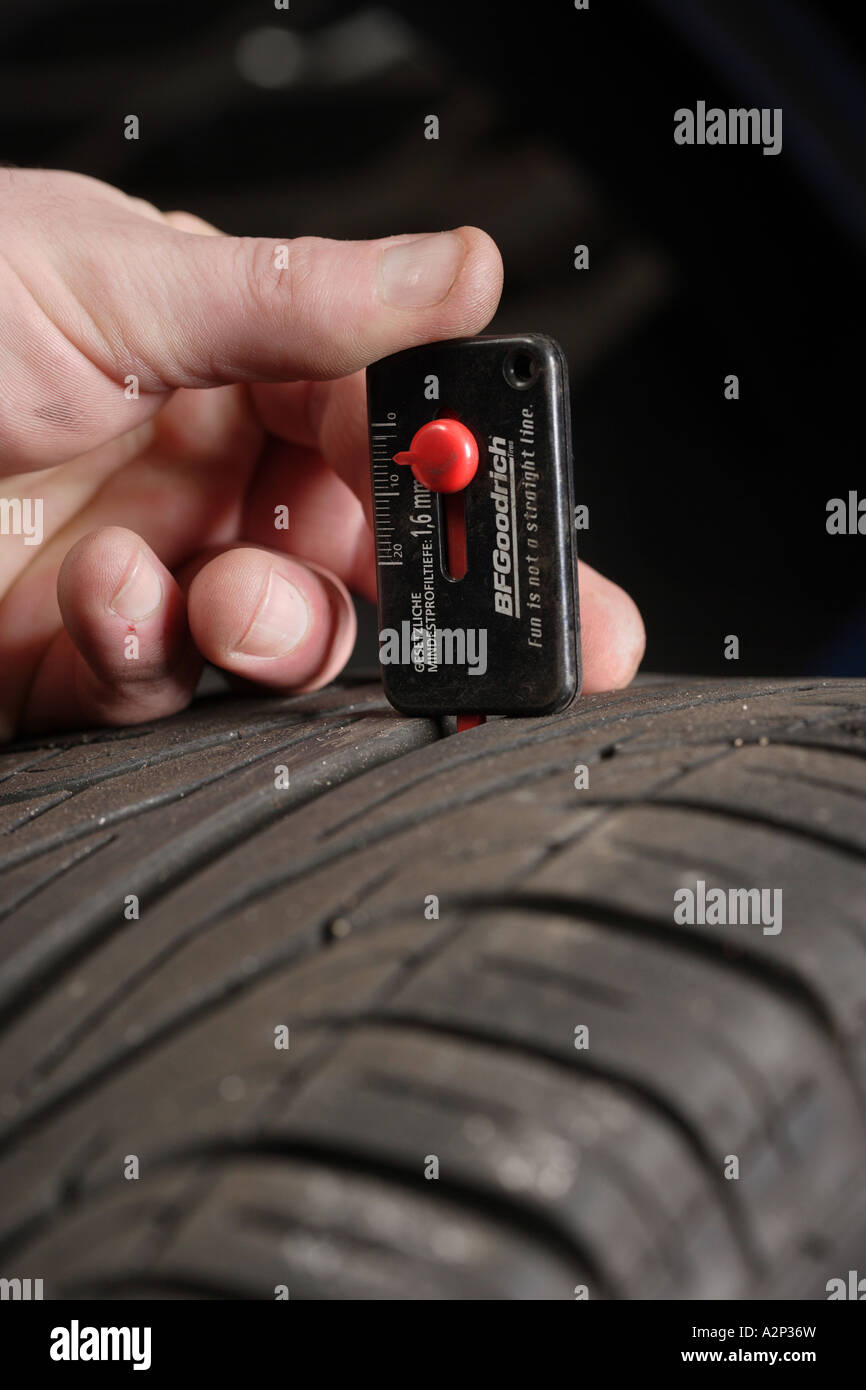 Control of the tyre tread with a measuring tool Stock Photo - Alamy