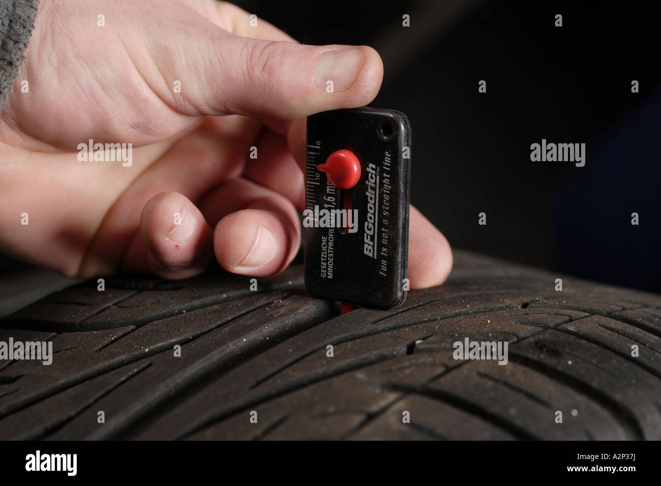 Control of the tyre tread with a measuring tool Stock Photo - Alamy