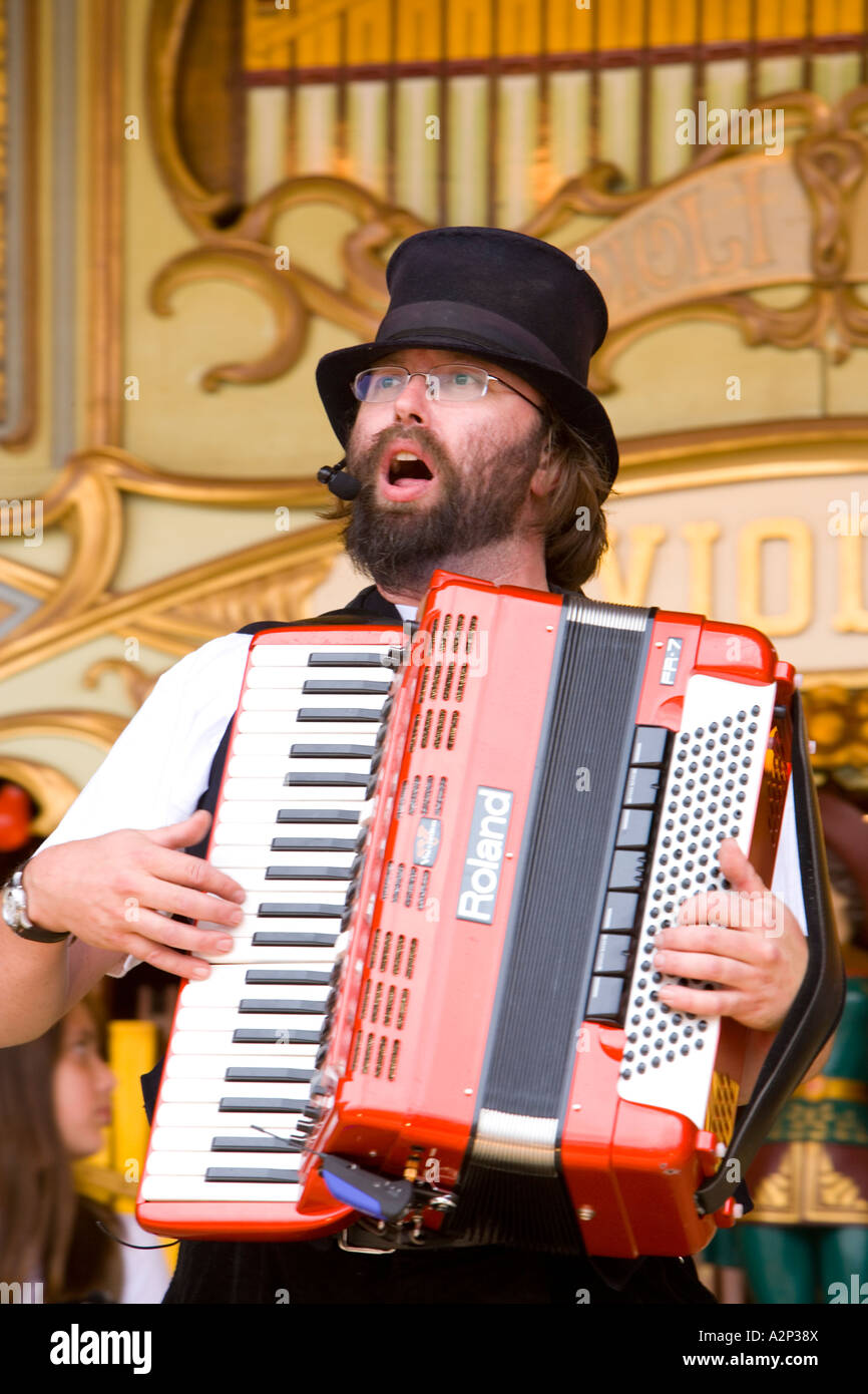 folk singer playing a digital piano accordian at a country steam fair ...