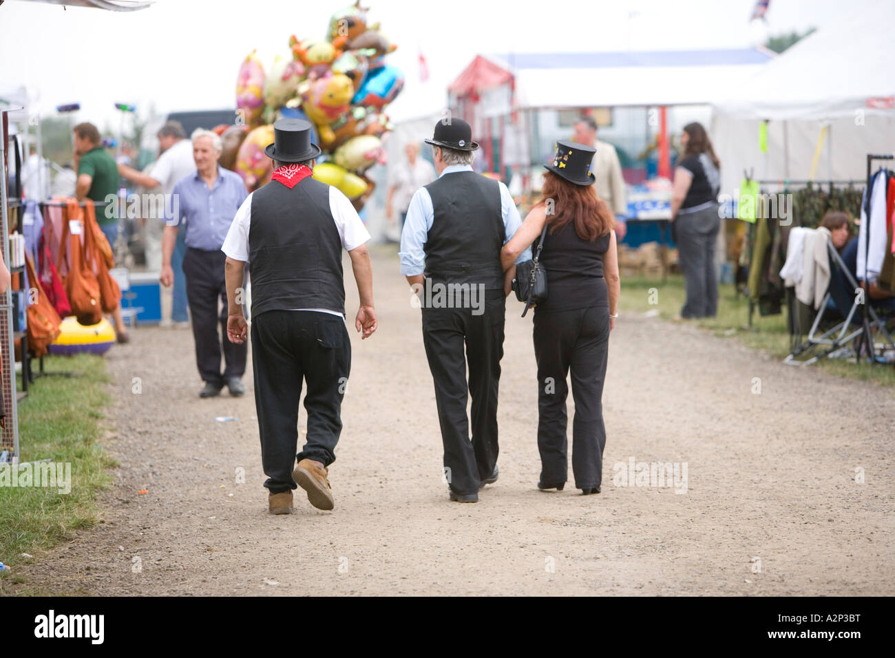 3 people in victorian costume at Pickering steam fair in yorkshire ...