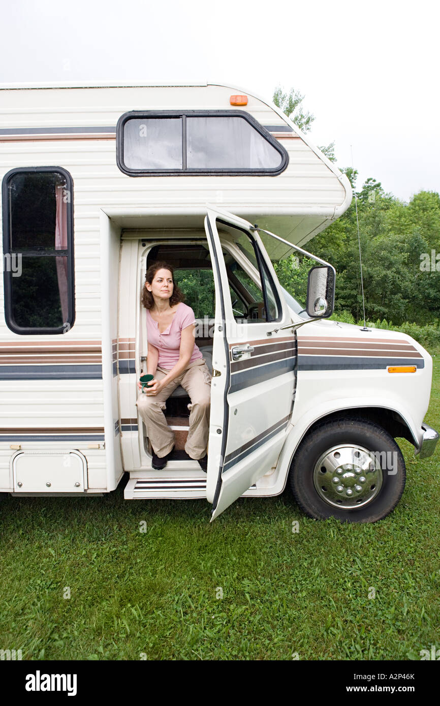 Mature woman sitting in a caravan Stock Photo - Alamy