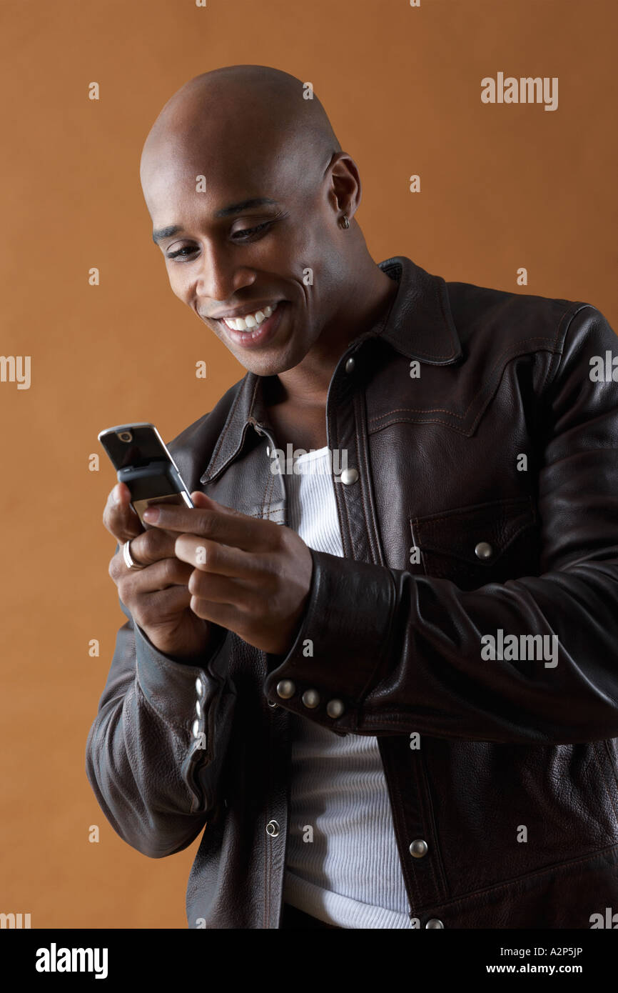 Man reading text message and smiling Stock Photo - Alamy