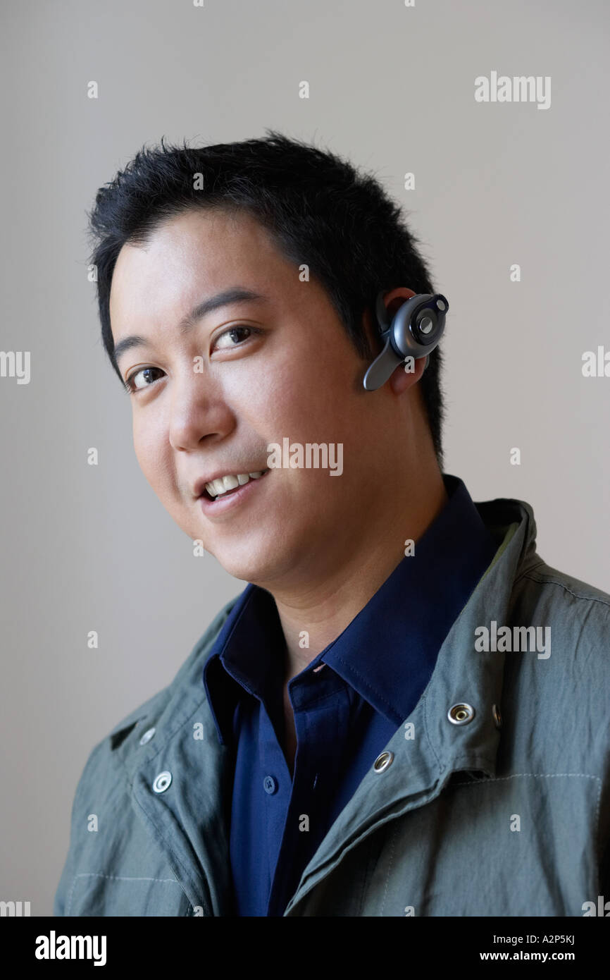 Man with hands free headset Stock Photo - Alamy