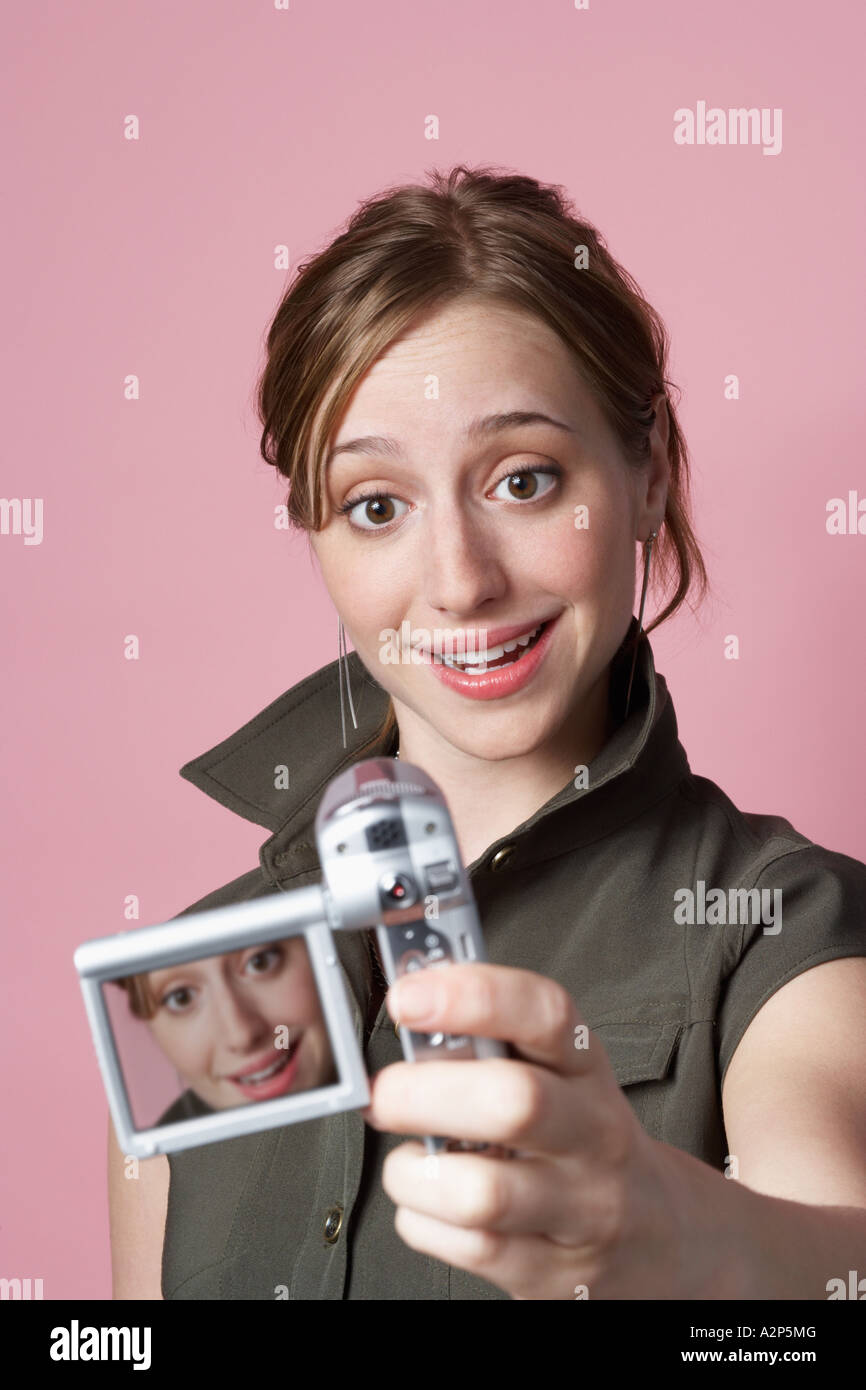 Woman filming herself Stock Photo - Alamy