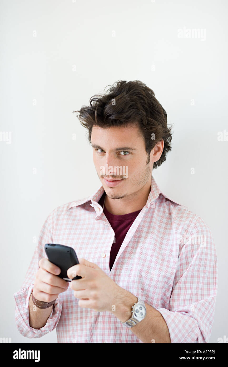 Young man with handheld computer Stock Photo - Alamy