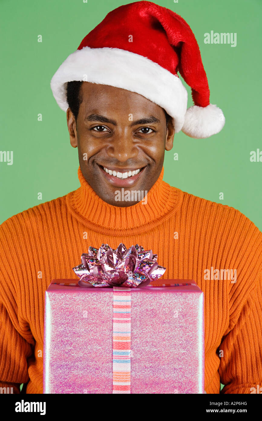 Man holding present Stock Photo - Alamy