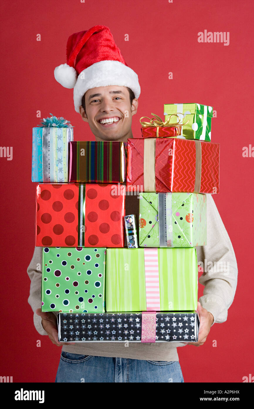 Man holding presents Stock Photo - Alamy