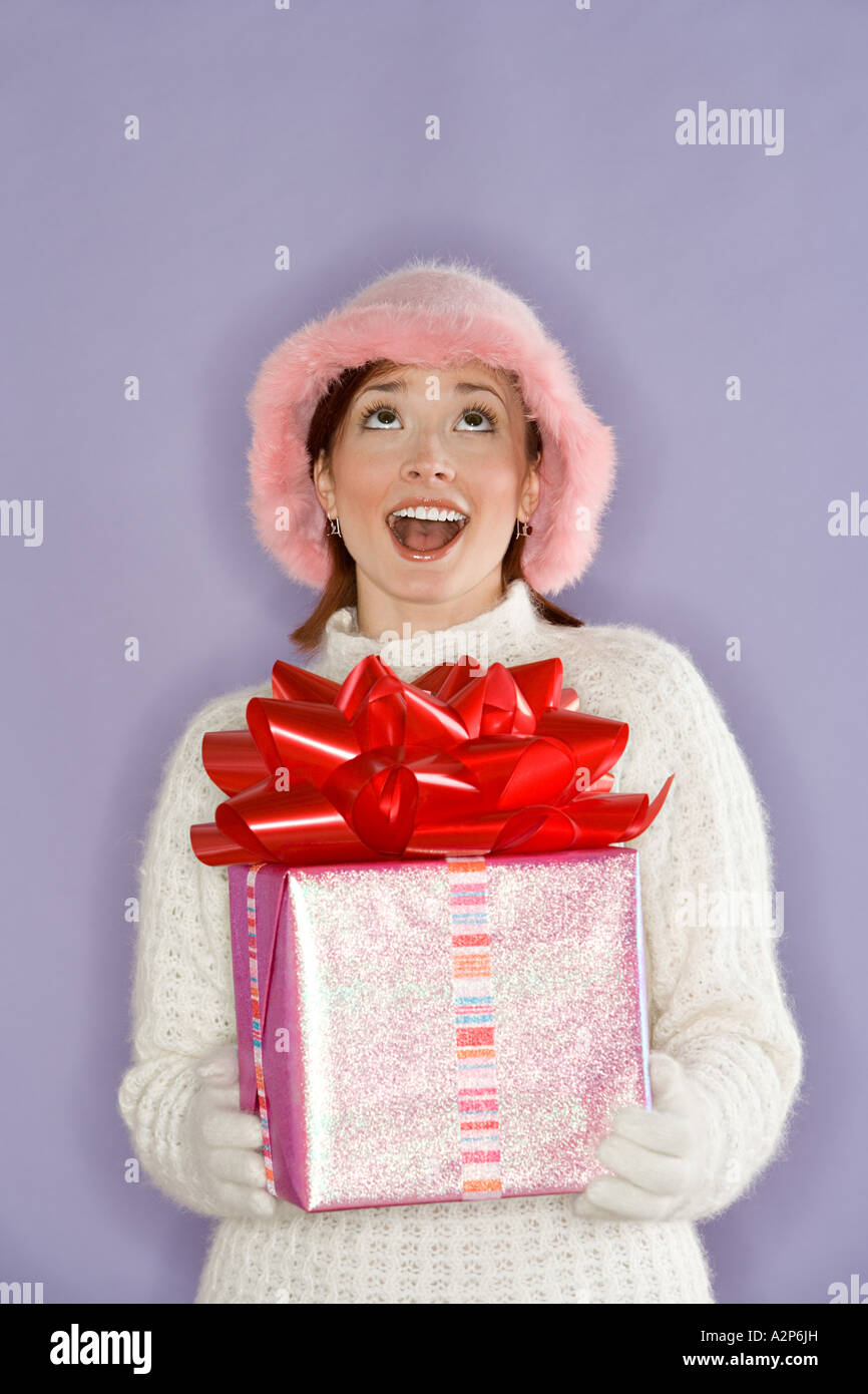 Woman holding present Stock Photo - Alamy
