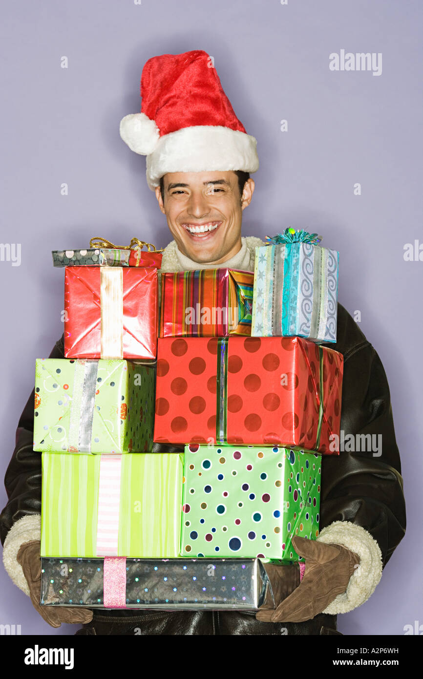 Man holding presents Stock Photo - Alamy