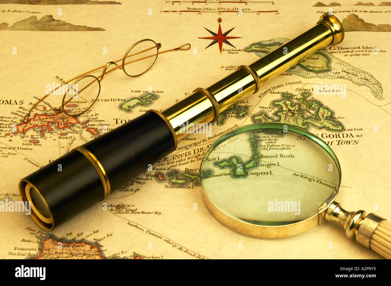 antique map gold rimmed spectacles telescope and magnifying glass Stock ...