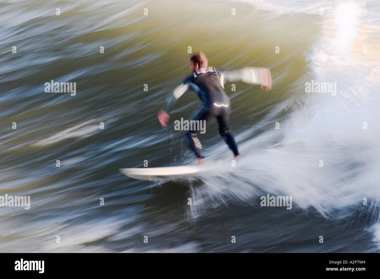 Surfer riding a wave at the Sandspit sandbar in Santa Barbara, CA ...