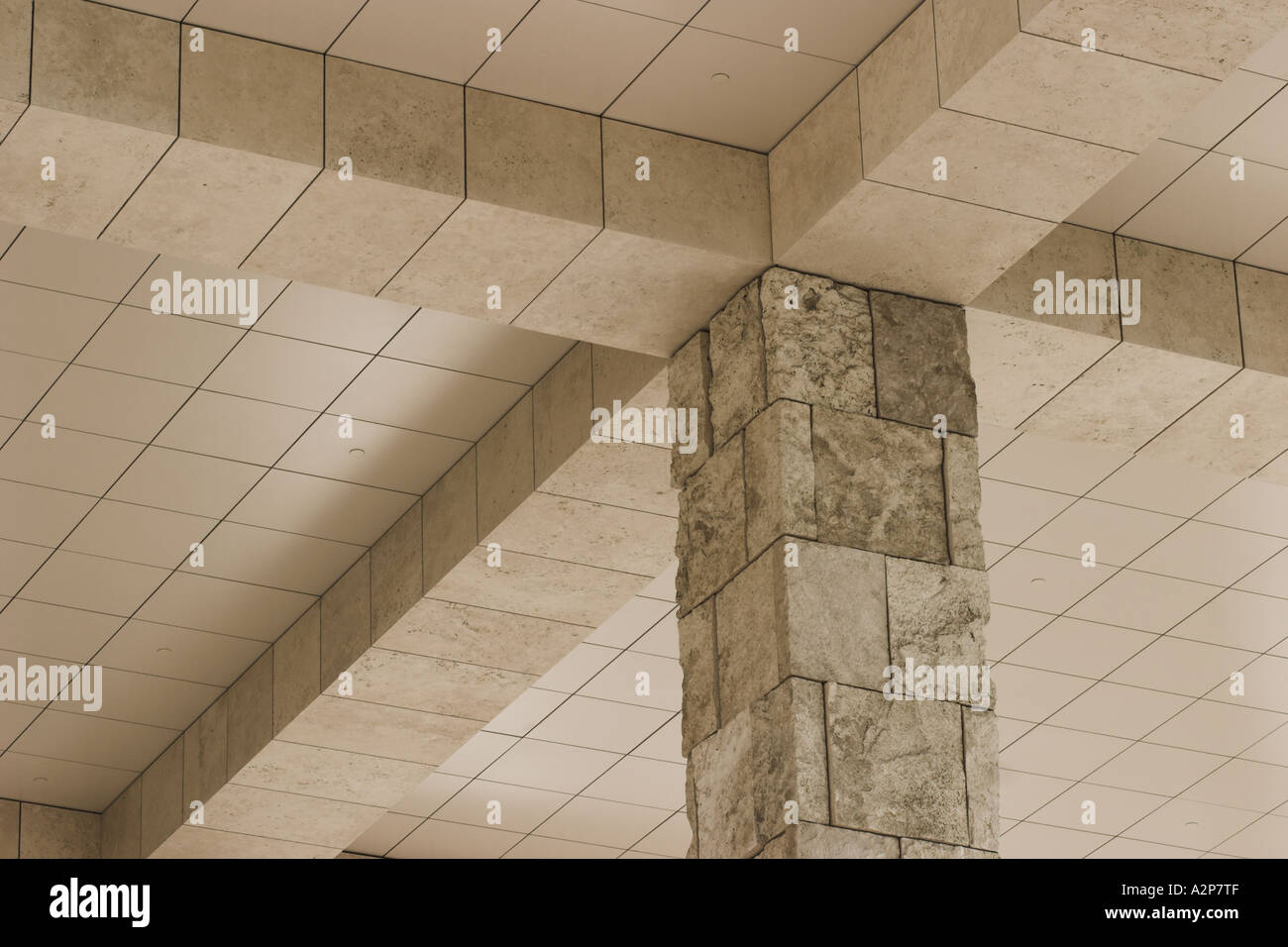 A stone and tile pillar supporting the ceiling of a building at the J ...