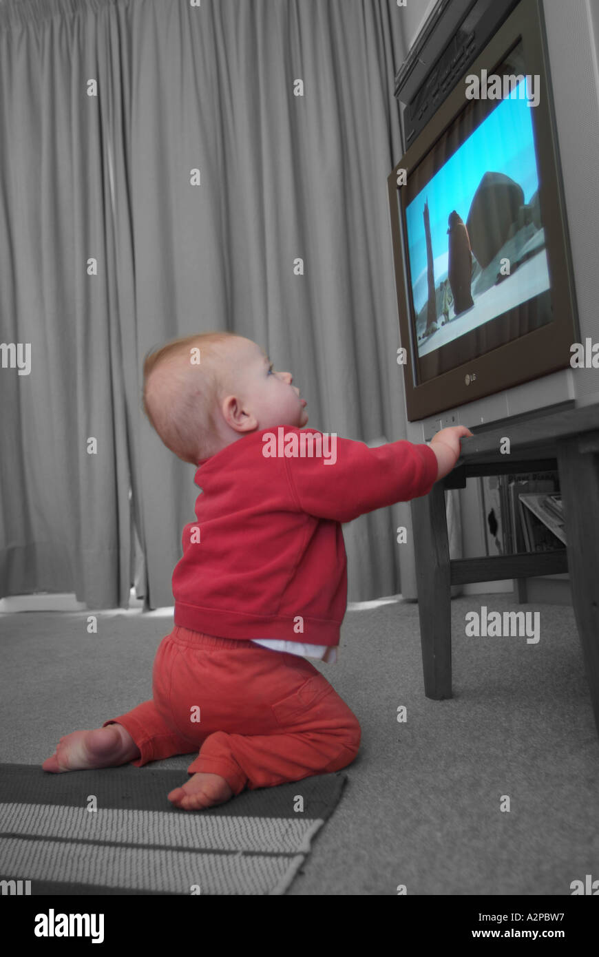 Young child in front of television tv Stock Photo - Alamy