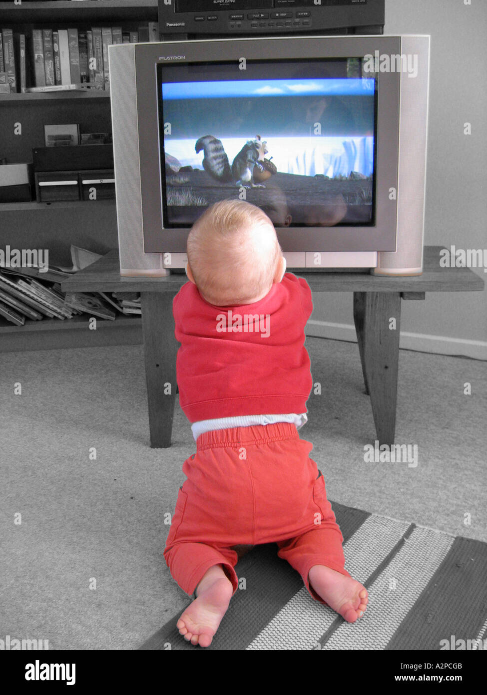 Young child in front of television tv Stock Photo - Alamy