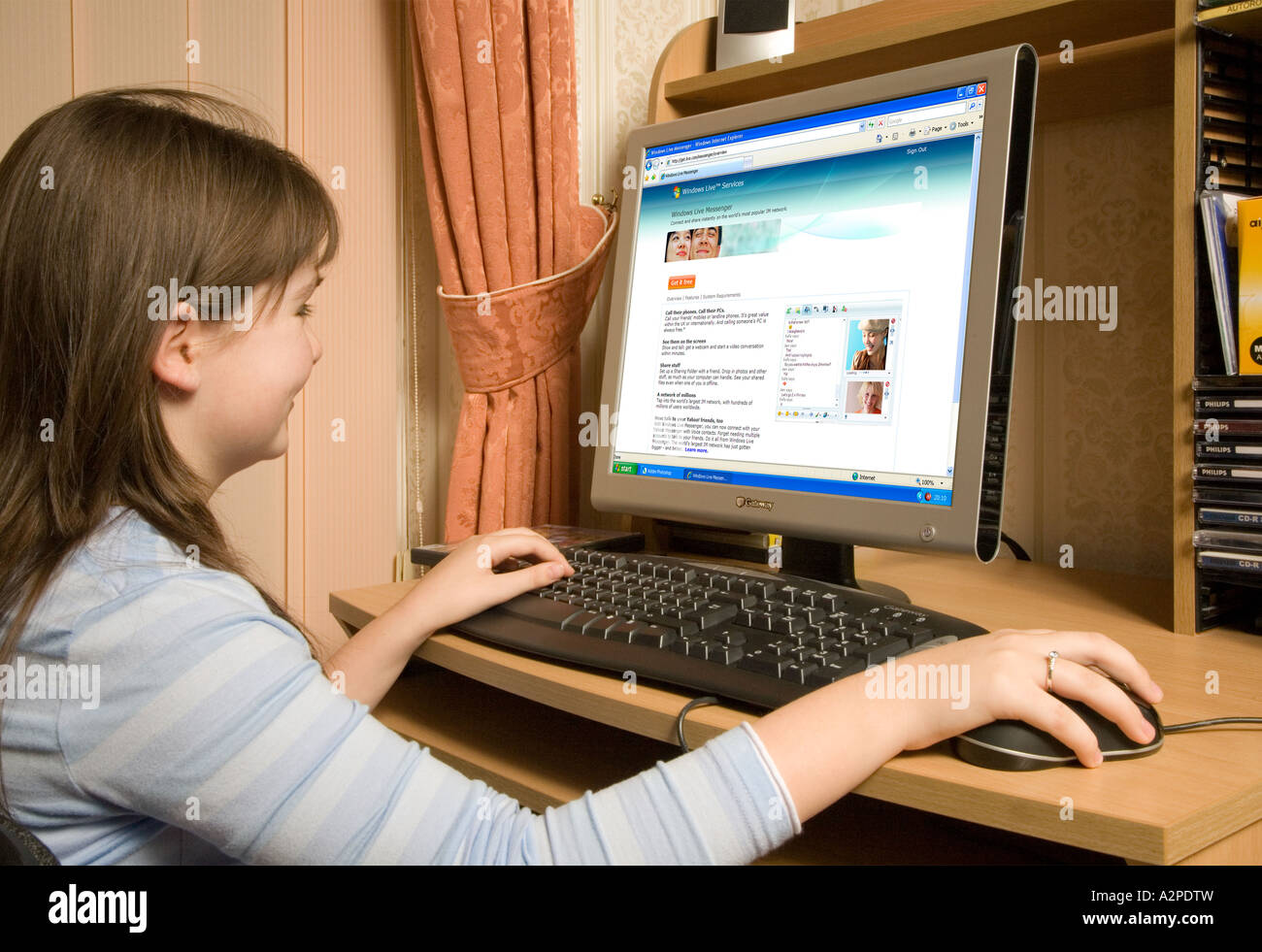 11 year old white British school girl emailing on home computer Stock ...