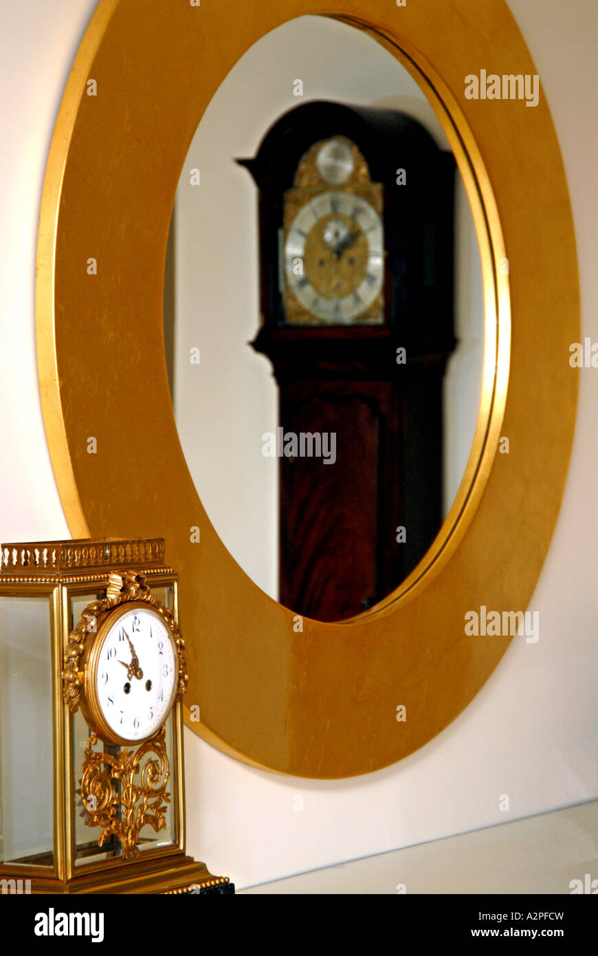 Antique clocks and mirror Stock Photo - Alamy