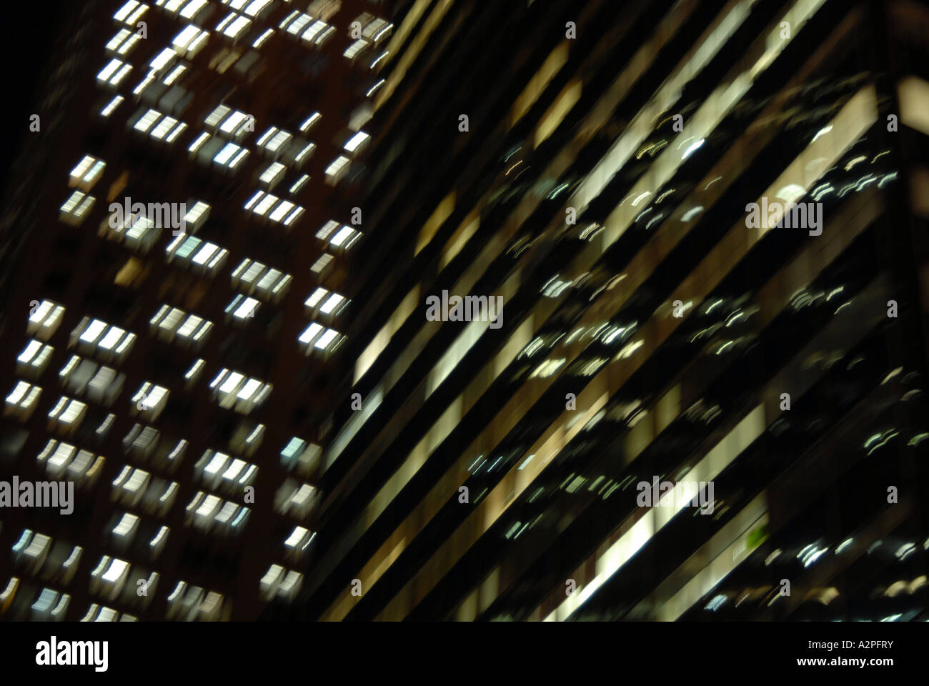 Night time lights reflected off two New York City skyscrapers Stock ...