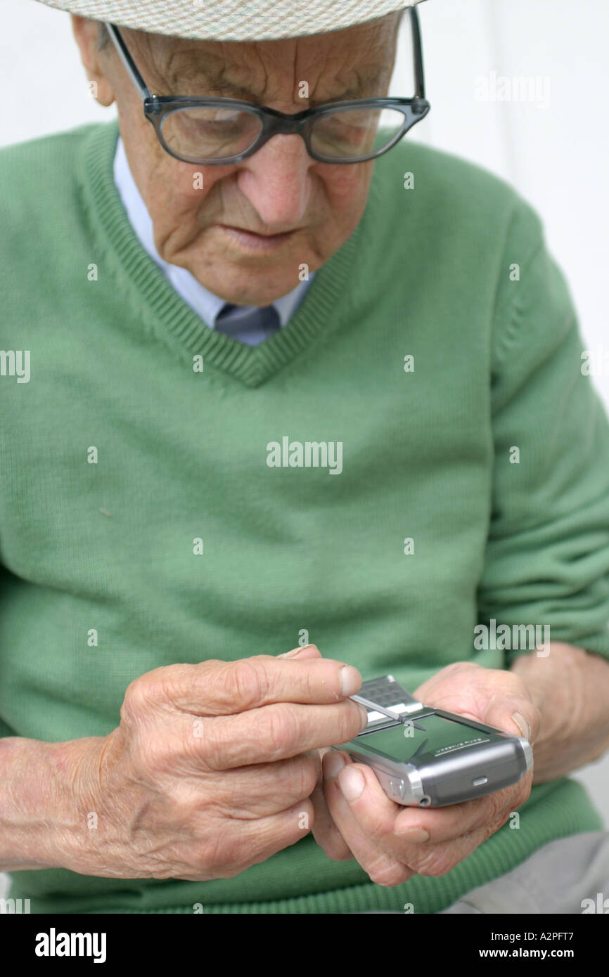 old man with mobile phone / PDA Stock Photo - Alamy