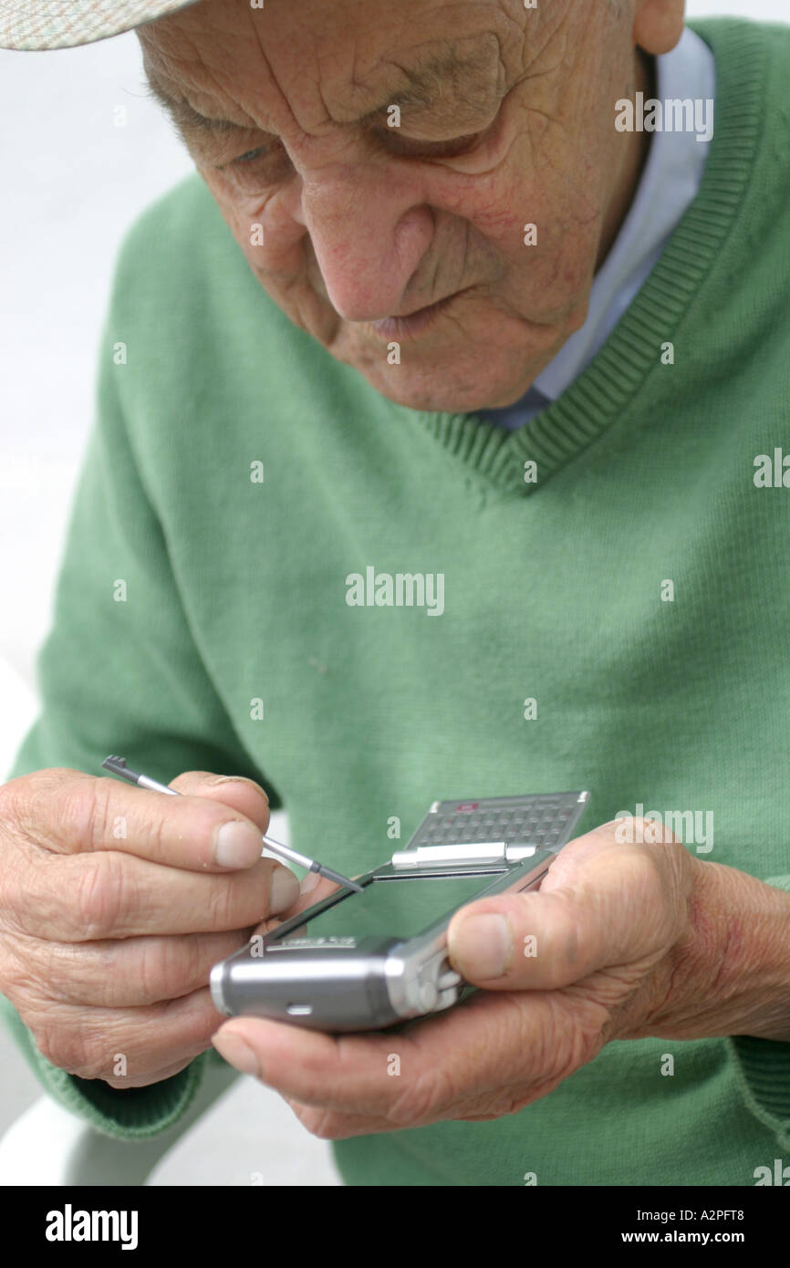 old man with mobile phone / PDA Stock Photo - Alamy