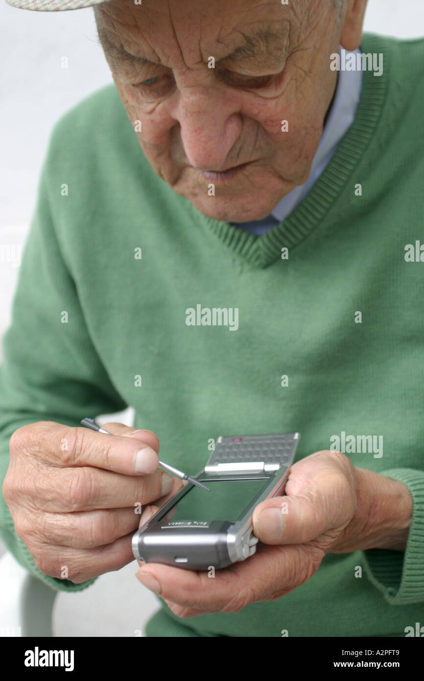 old man with mobile phone / PDA Stock Photo - Alamy