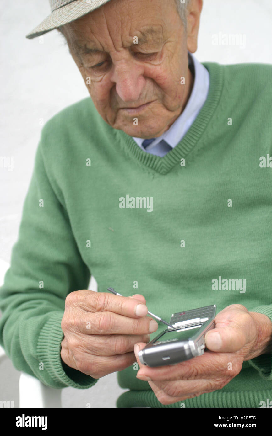 old man with mobile phone / PDA Stock Photo - Alamy