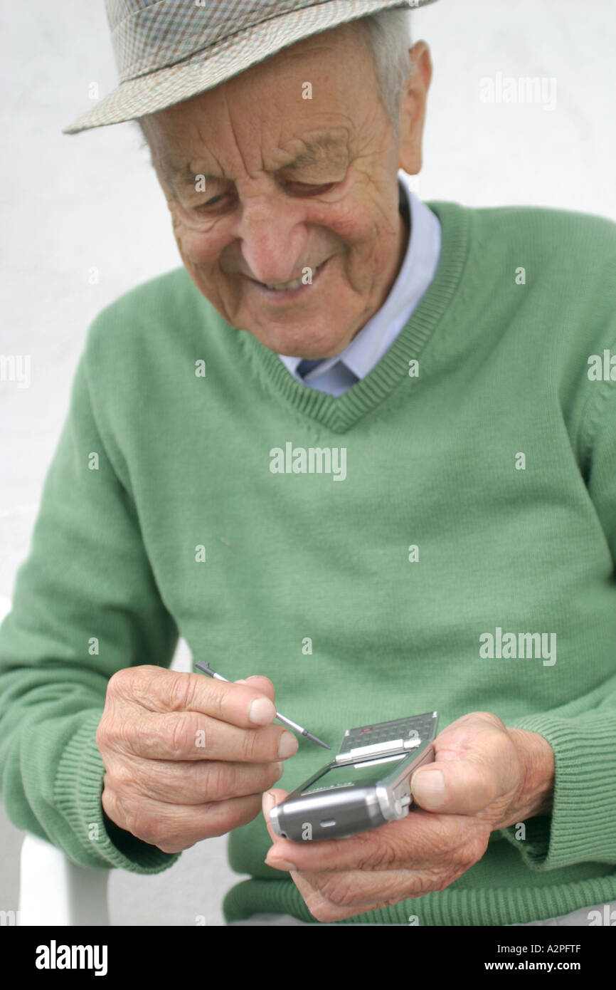 old man with mobile phone / PDA Stock Photo - Alamy